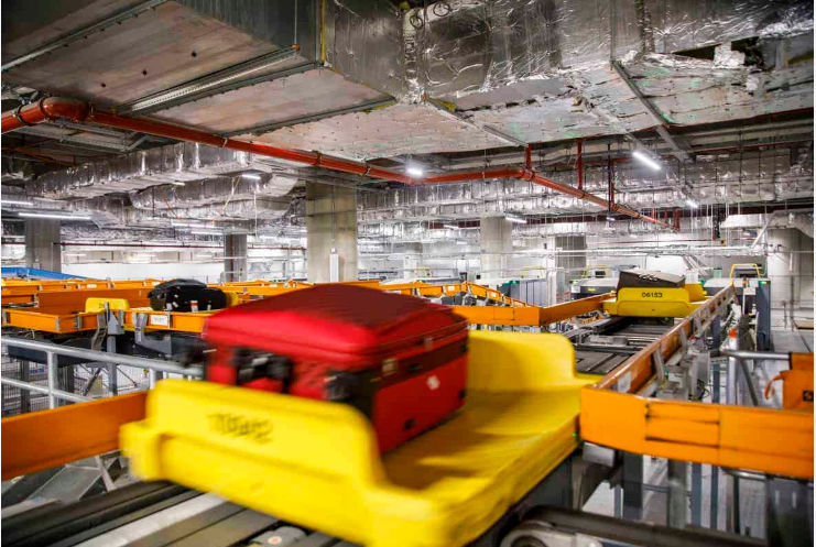 Belt conveyor - TUBTRAX - VANDERLANDE - baggage / horizontal / for airport