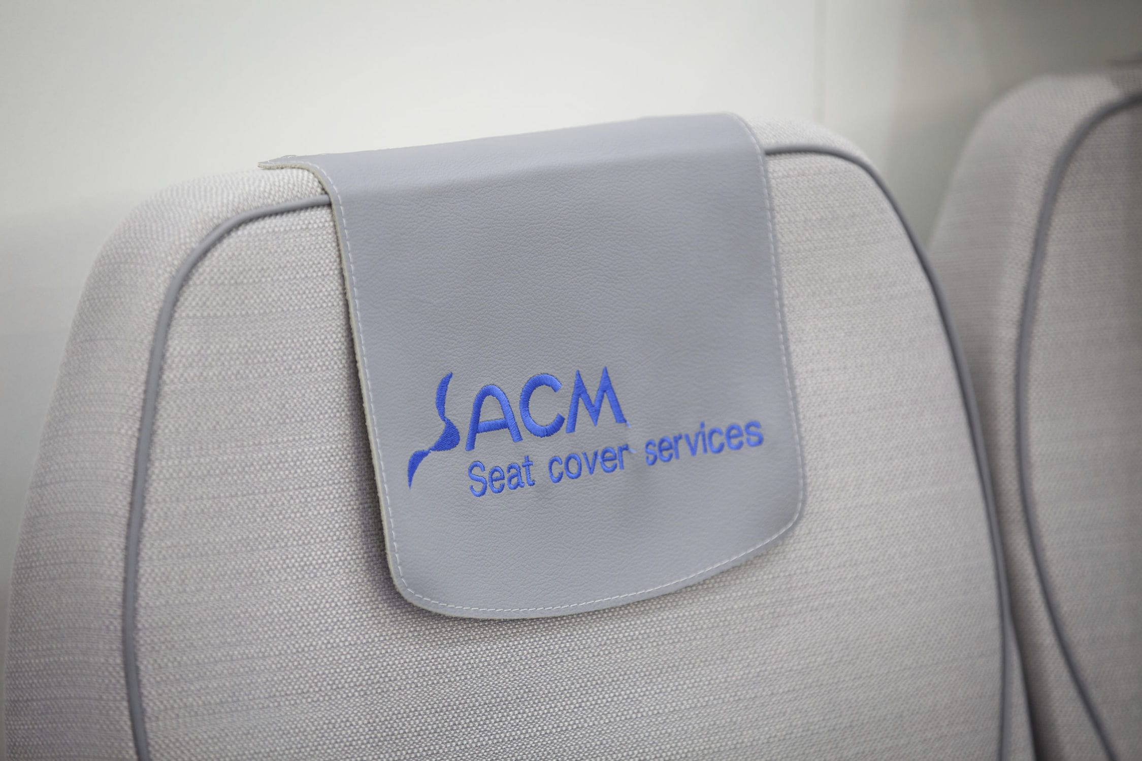 Aircraft cabin headrest cover - ACM - Aircraft Cabin Modification - GmbH